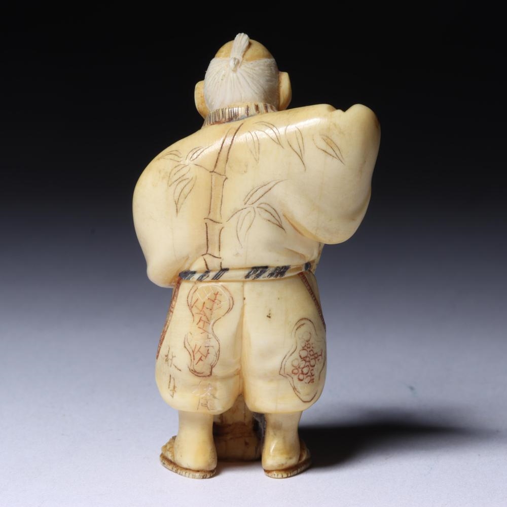White | Japanese carved bone figural netsuke: elder man | MutualArt