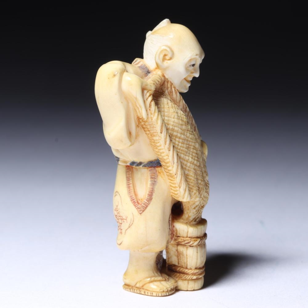 White | Japanese carved bone figural netsuke: elder man | MutualArt