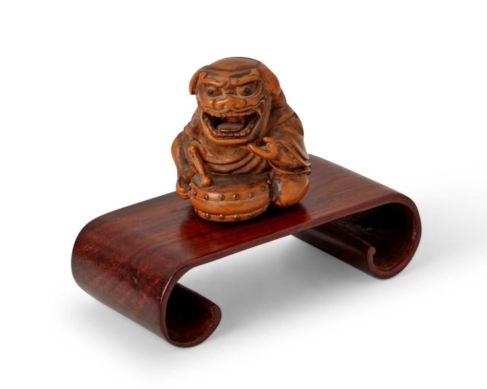 Japanese School | A Japanese carved hardwood Oni netsuke | MutualArt