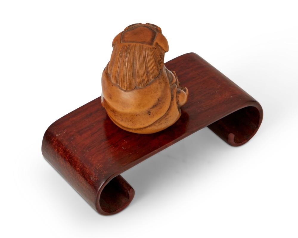 Japanese School | A Japanese carved hardwood Oni netsuke | MutualArt