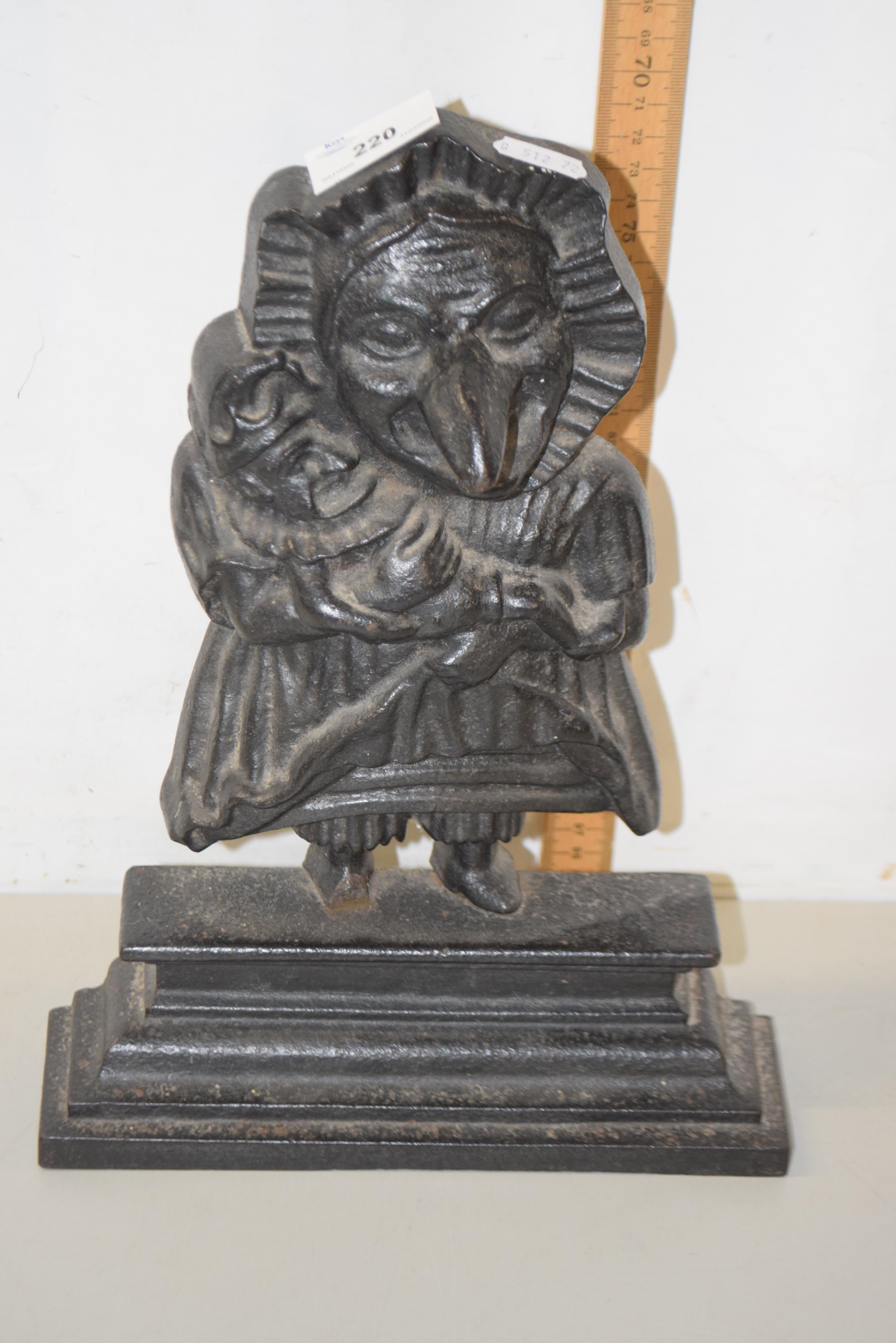 Punch | A cast iron Mrs Punch door stop | MutualArt