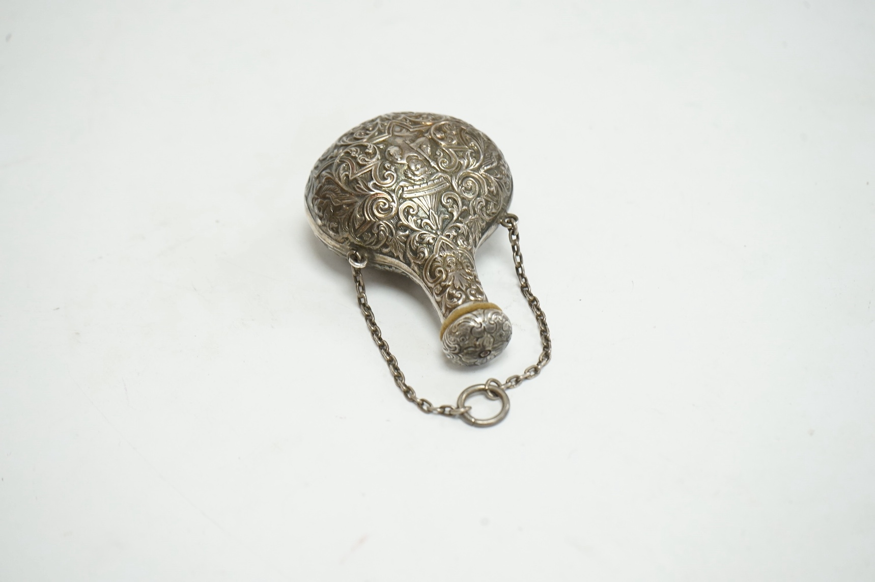 Solomon | A late 19th century embossed silver scent flask, decorated ...