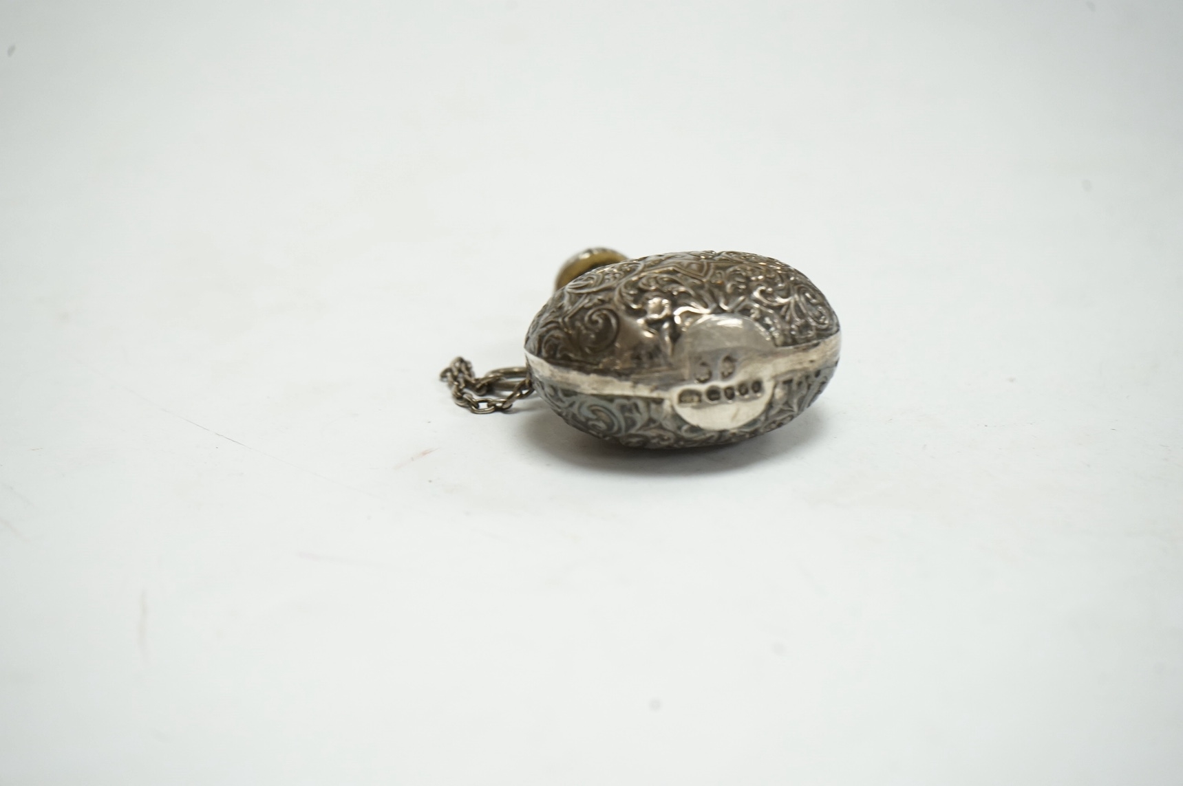 Solomon | A late 19th century embossed silver scent flask, decorated ...