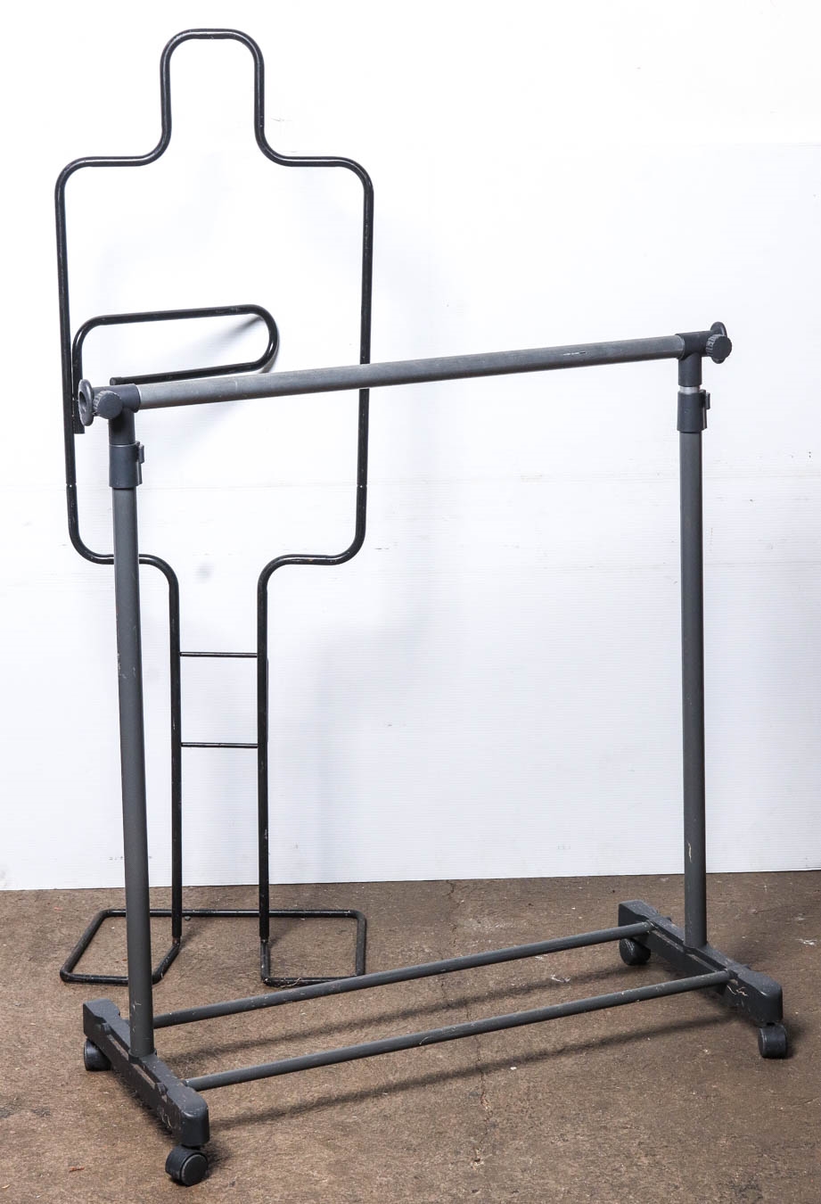 Human | A black human form display rack with swinging arm | MutualArt
