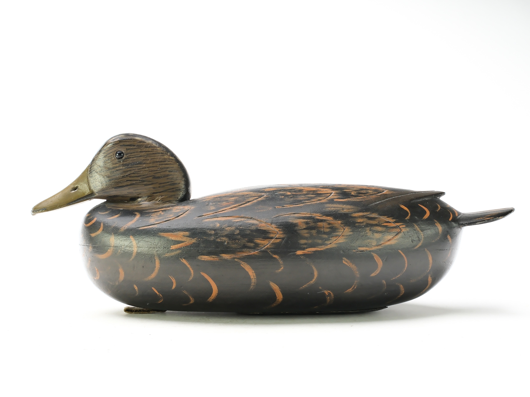 Dan English | Hollow carved black duck with tucked head and raised ...
