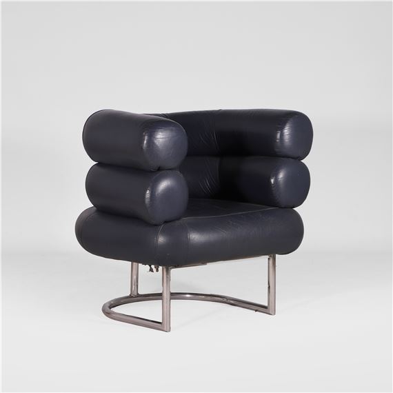 Eileen Gray | a Bibendum tub chair in dark blue leather on chrome ...
