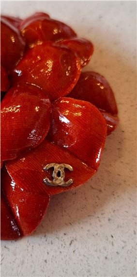 Chanel | Chanel-A large lacquered red Camelia brooch | MutualArt