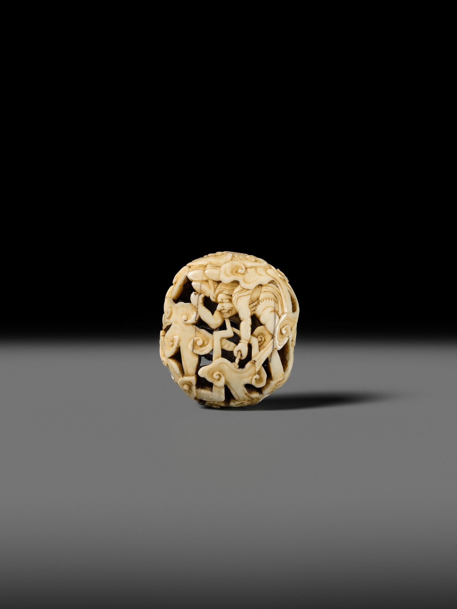 Walrus Tusk | A FINE WALRUS TUSK RYUSA MANJU NETSUKE OF RAIJIN | MutualArt