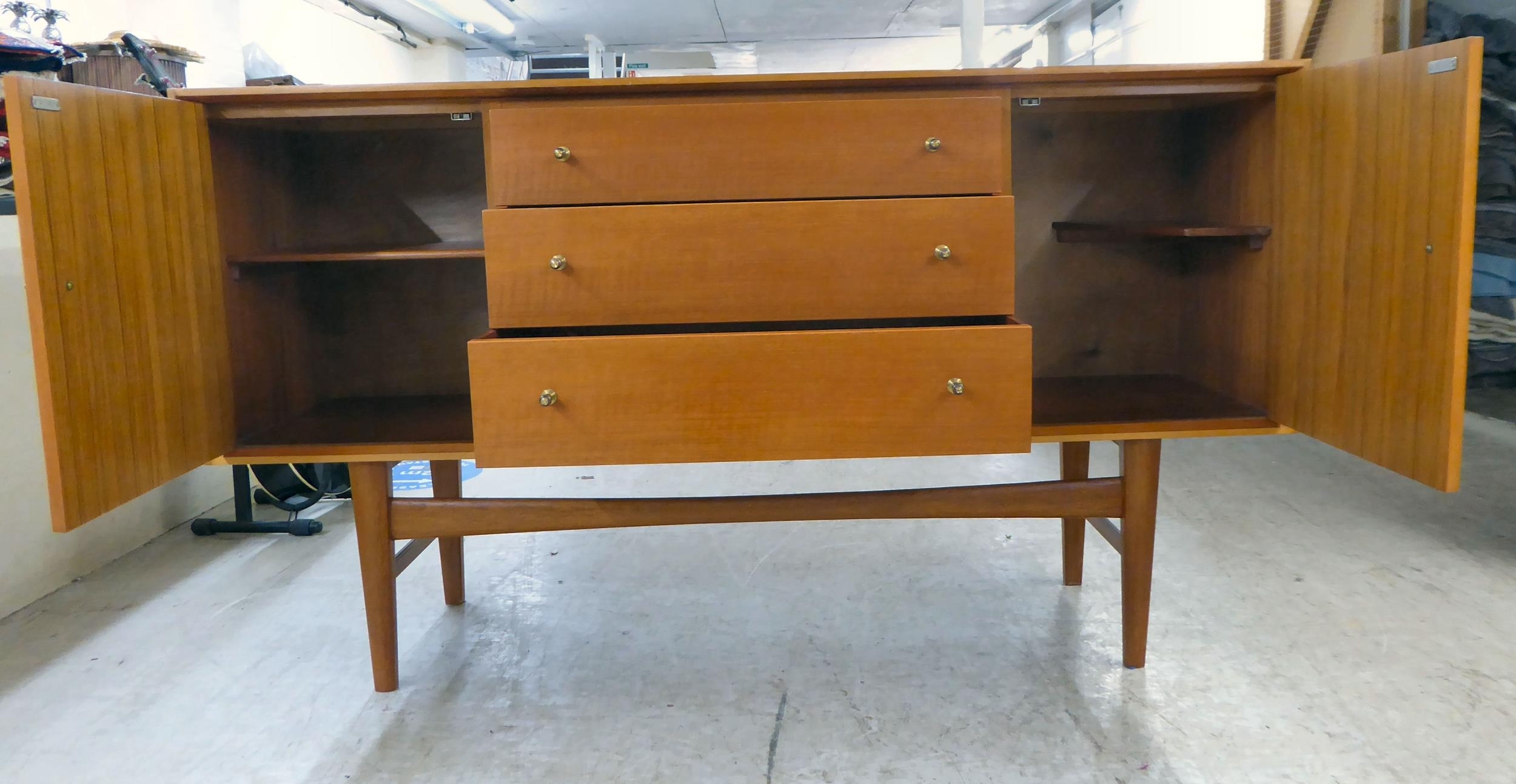 Gordon Russell | A Gordon Russell teak sideboard with a bank of three ...