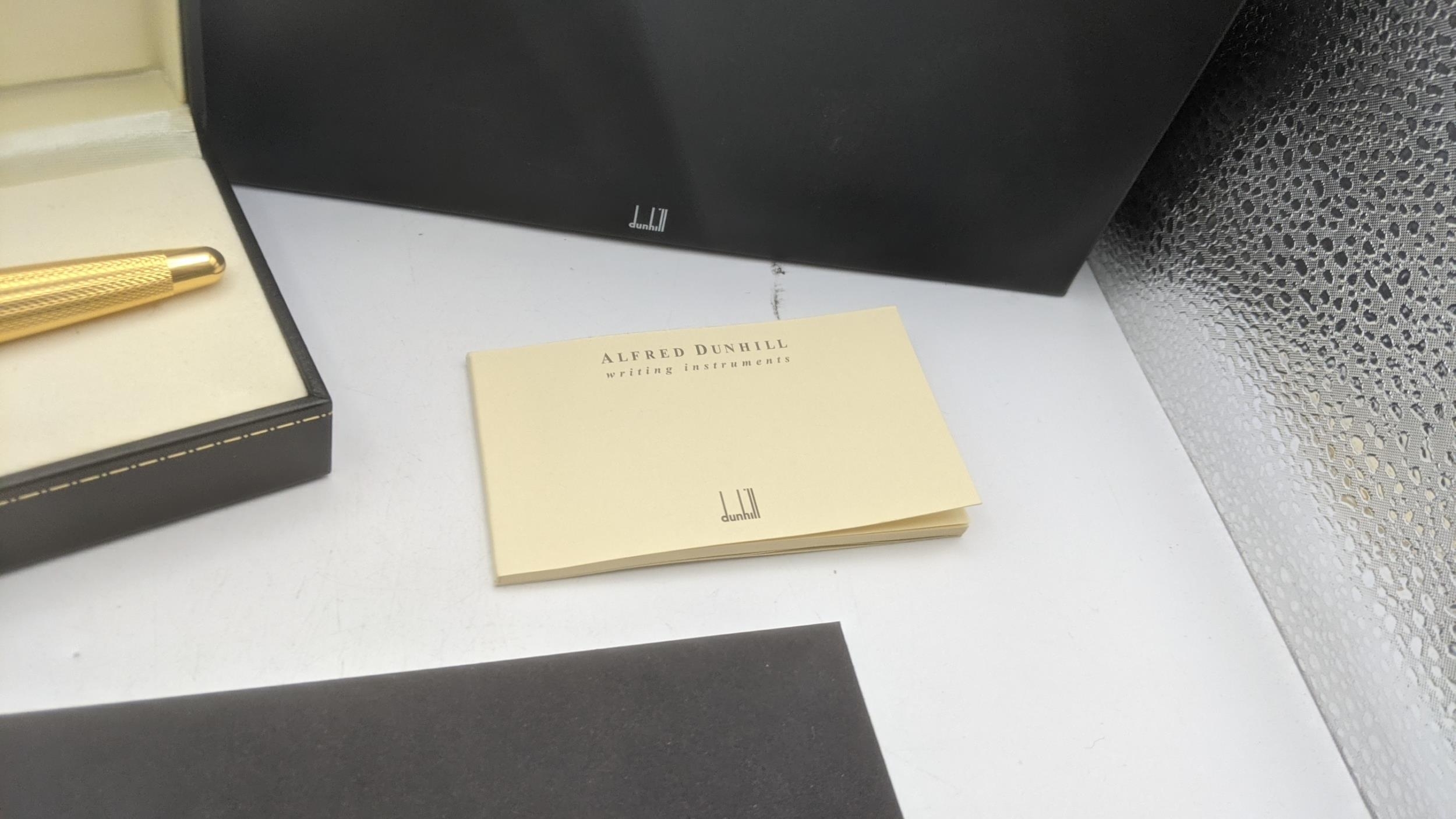 Alfred Dunhill | A gold plated Alfred Dunhill fountain pen with an 18ct ...