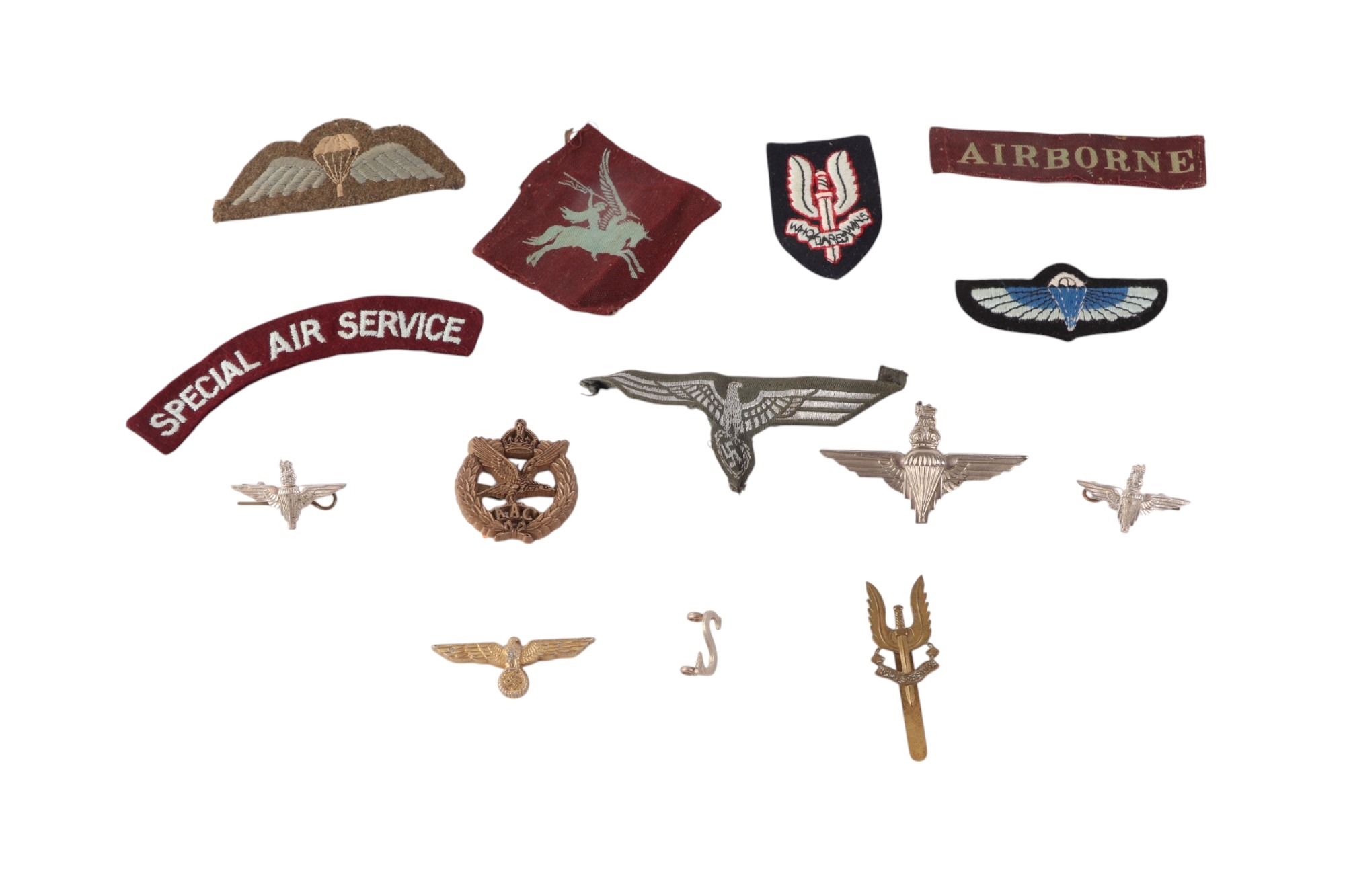 Pegasus | A group of WWII cloth badges and cap badges to include ...