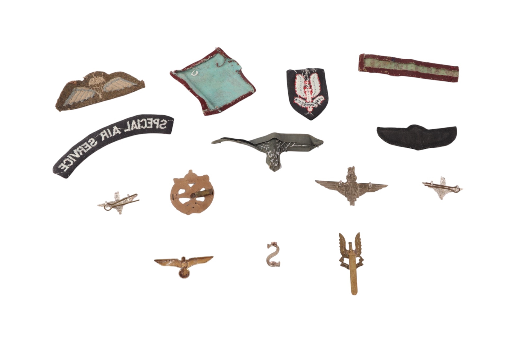 Pegasus | A group of WWII cloth badges and cap badges to include ...