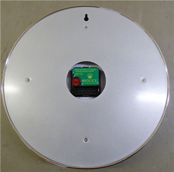 Rolex | A Rolex retailers shop display wall clock with a battery pow ...