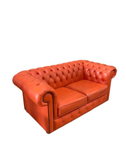 Chesterfield | An orange leather button back Chesterfield sofa | MutualArt