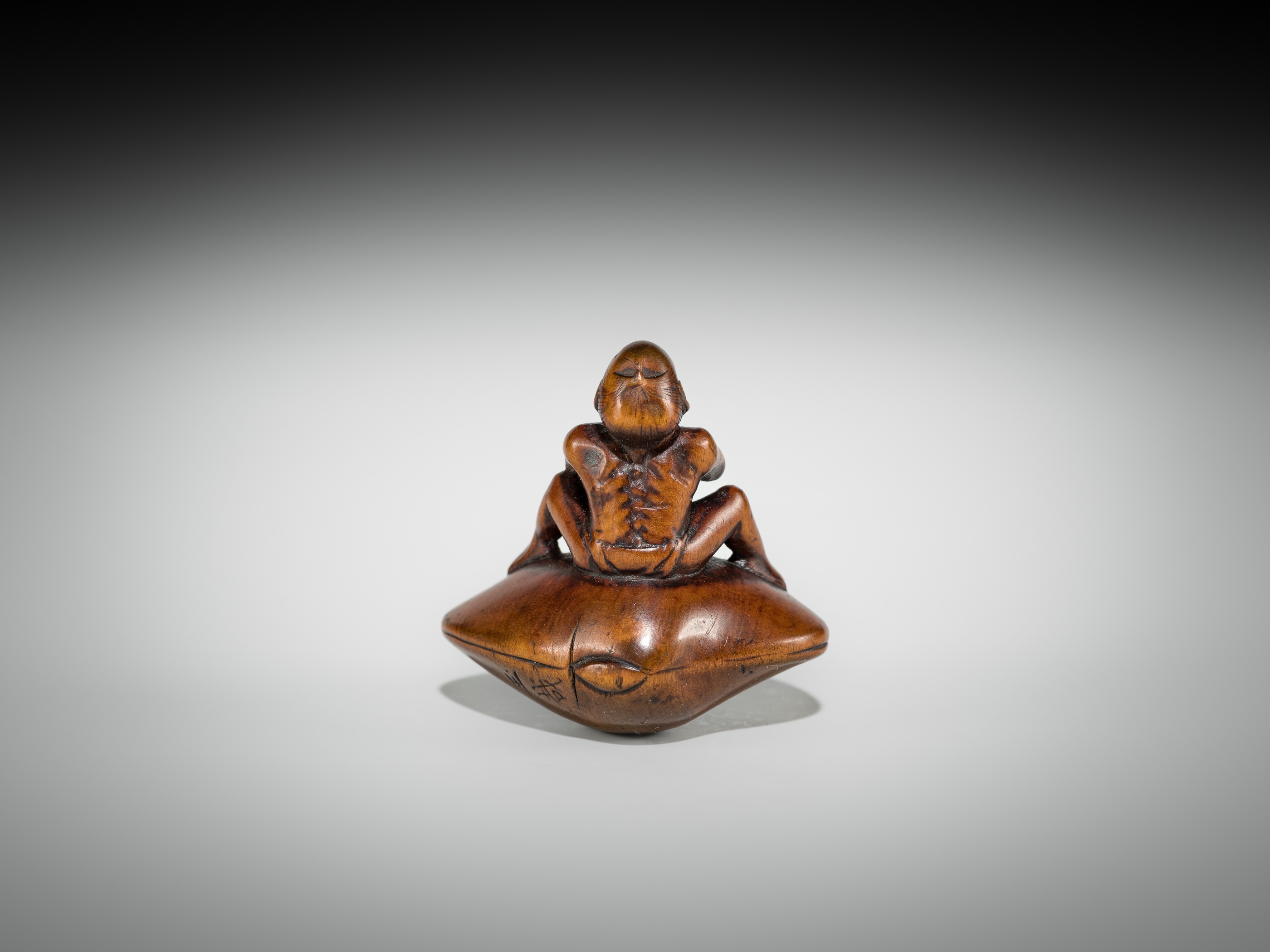 Gyokusai | GYOKUSAI: A FINE WOOD SHUNGA NETSUKE OF MAN ON A HAMAGURI ...