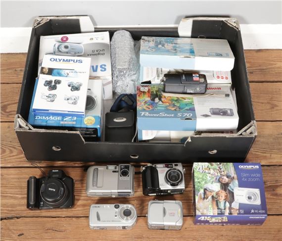 Betty V. Devonald | A box of twelve various digital cameras, including ...