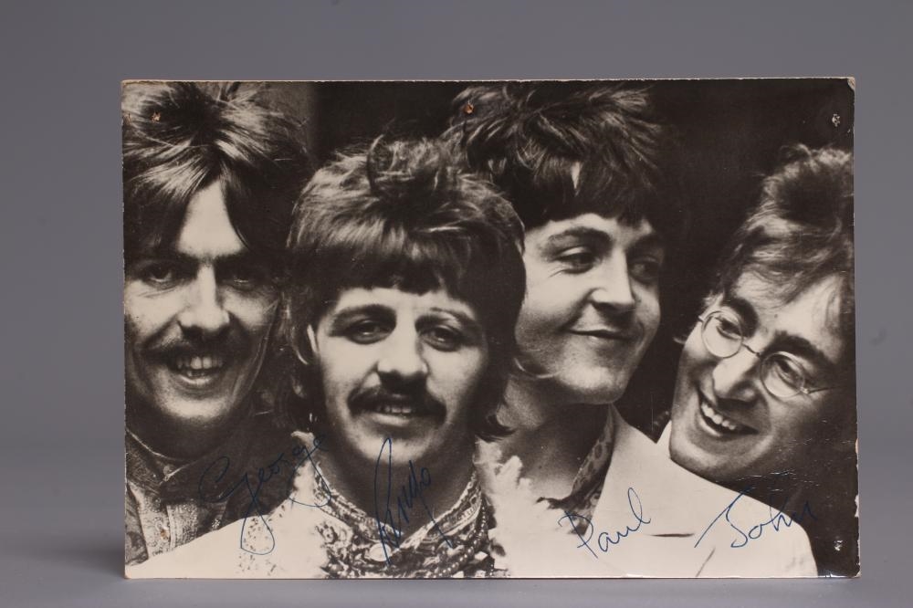 The Beatles | AN AUTOGRAPHED PHOTOGRAPH OF THE BEATLES, signed in blue ...