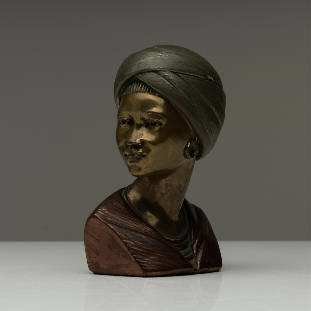 Casper Darare | A resin bronzed and coppered bust of a woman wearing ...