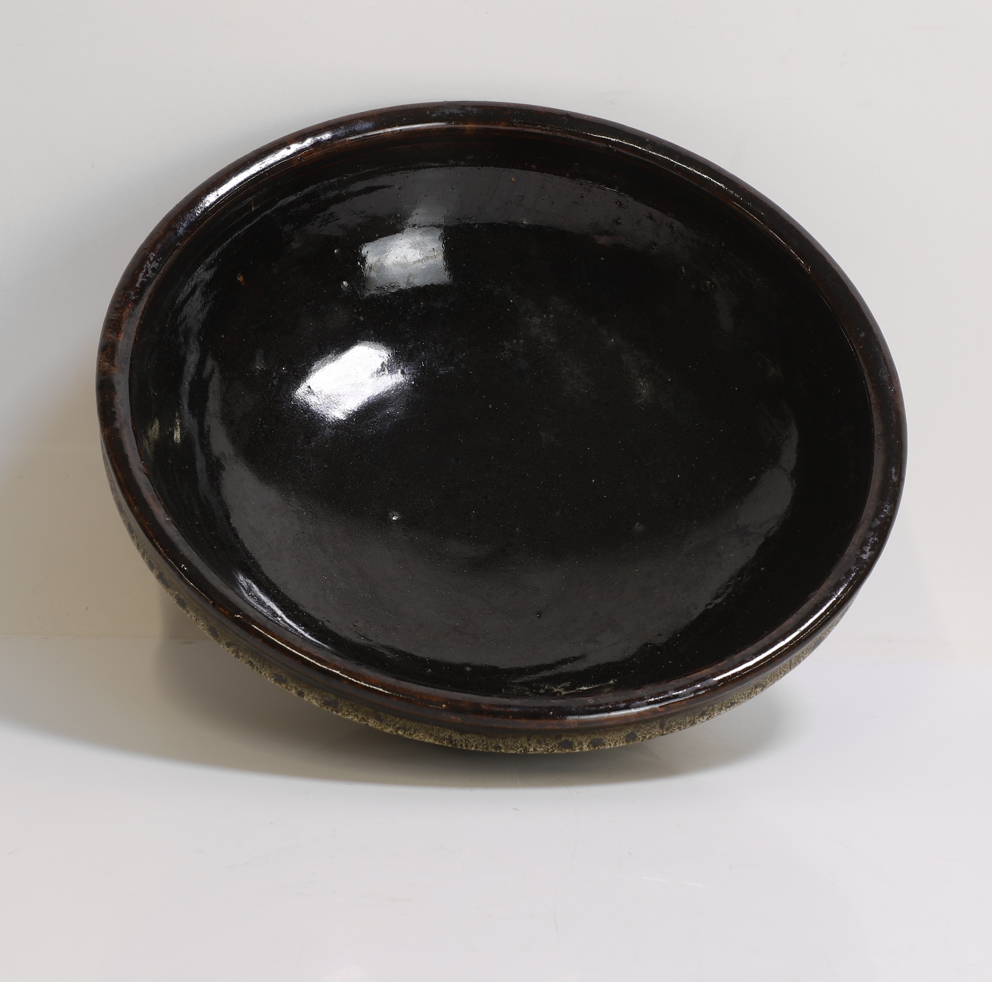 Abdo Nagi | a stoneware bowl covered in a heavily mottled oatmeal glaze ...