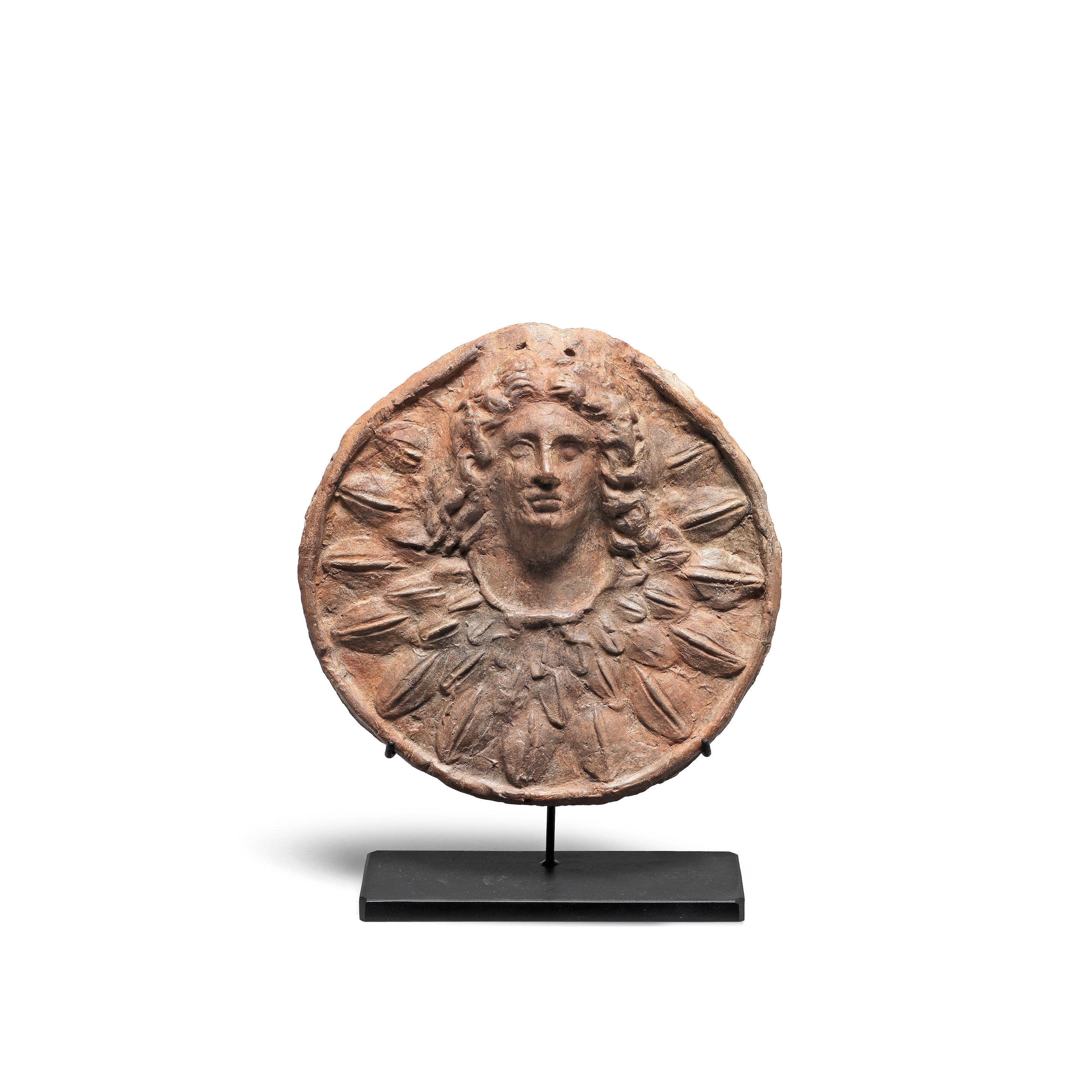 Greek School | A Hellenistic terracotta roundel with Alexander ...