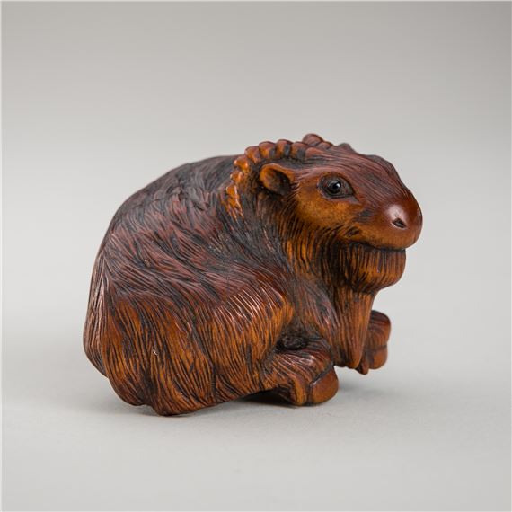 Japanese School, 20th Century | A WOOD NETSUKE OF A RECUMBENT GOAT ...
