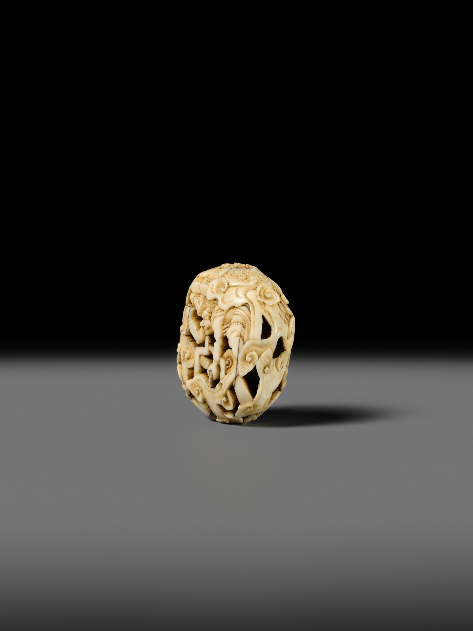 Walrus Tusk | A FINE WALRUS TUSK RYUSA MANJU NETSUKE OF RAIJIN | MutualArt