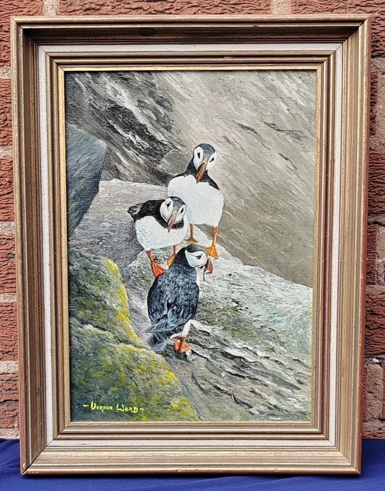 Vernon Ward | three puffins standing on a rock | MutualArt