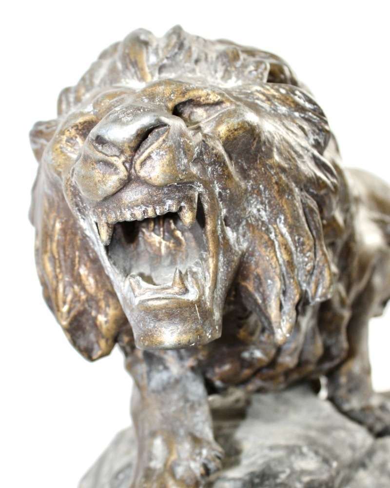 T. Cartier | A Large Decorative metal figure of a roaring Lion on a ...