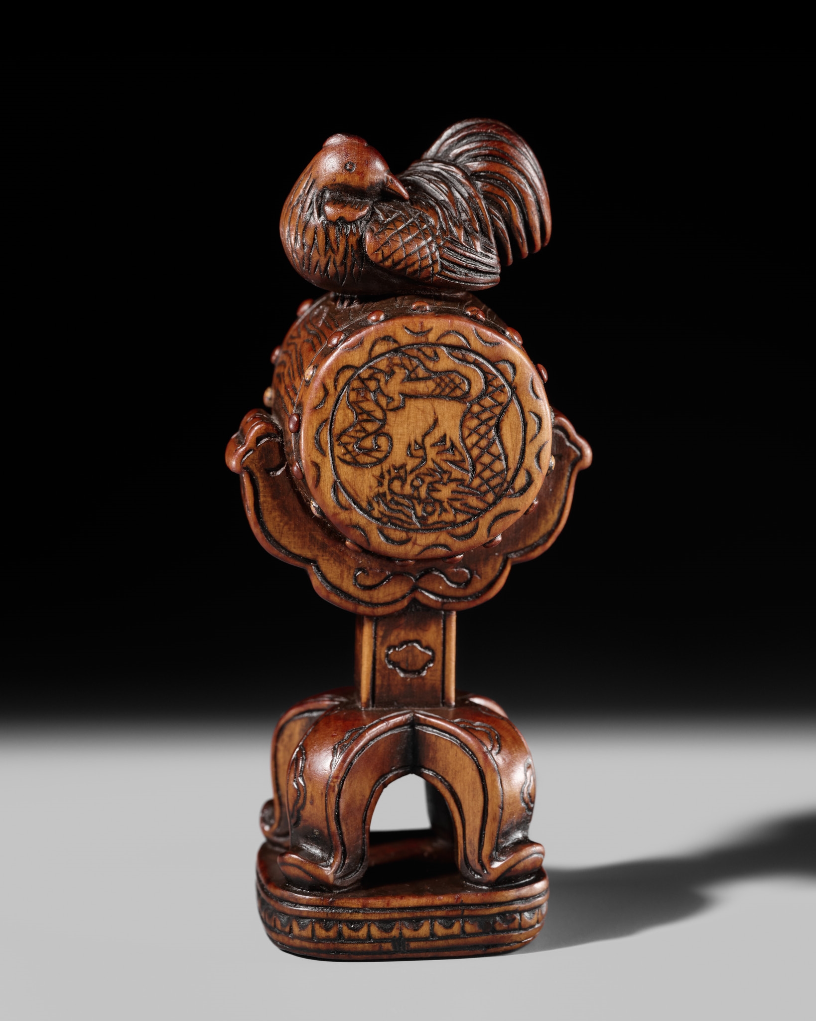 Tametaka | A LARGE WOOD INGYO (SEAL) NETSUKE OF A COCKEREL ON A WAR ...