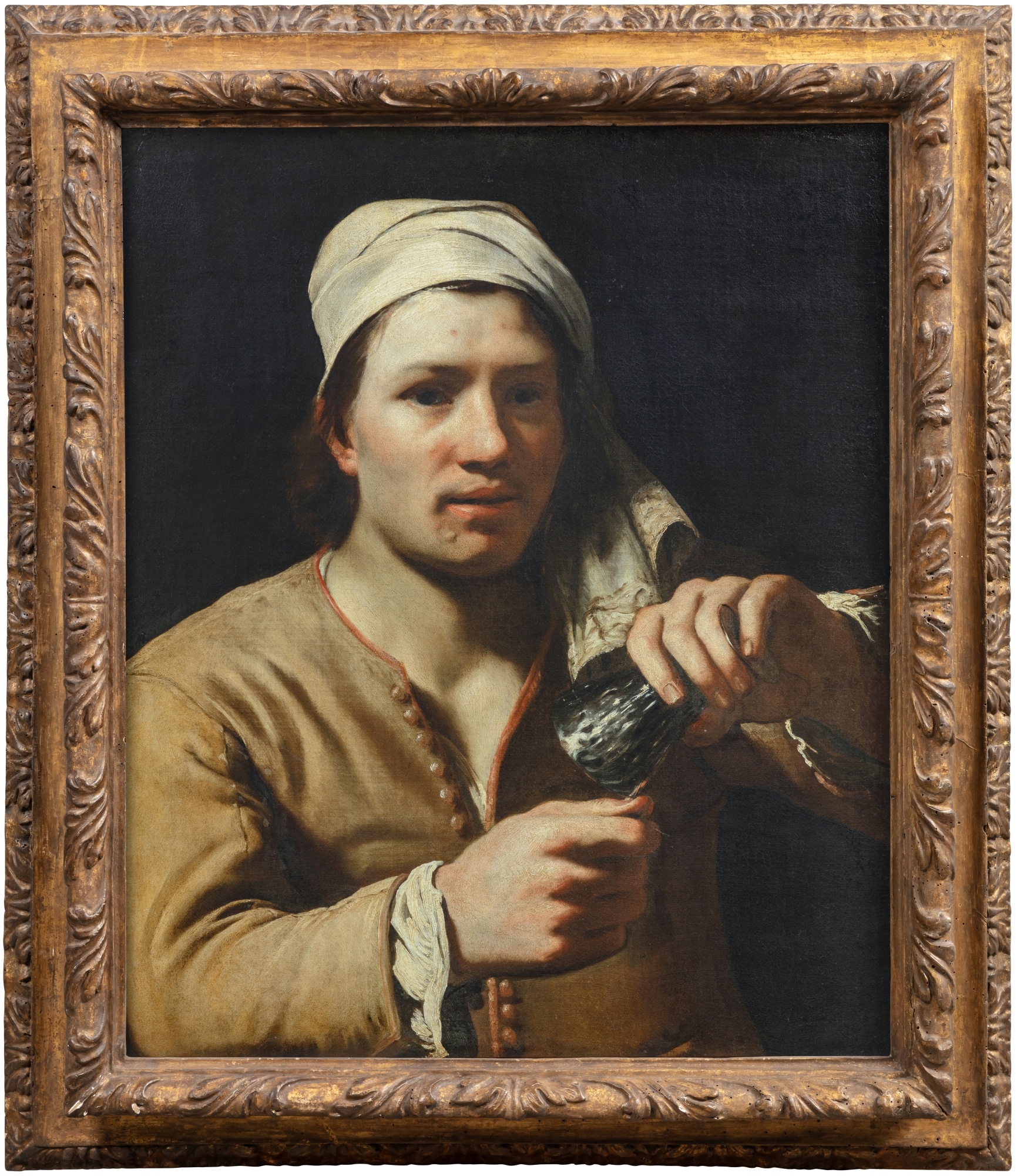 Michiel Sweerts | A young man wearing a turban holding an upturned ...