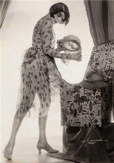 Atelier Manasse | Ruth Gold in dressing gown selecting a hat, c. 1928 ...