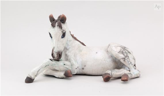 Keza Rudge | a raku sculpture of a reclining horse covered in white ...