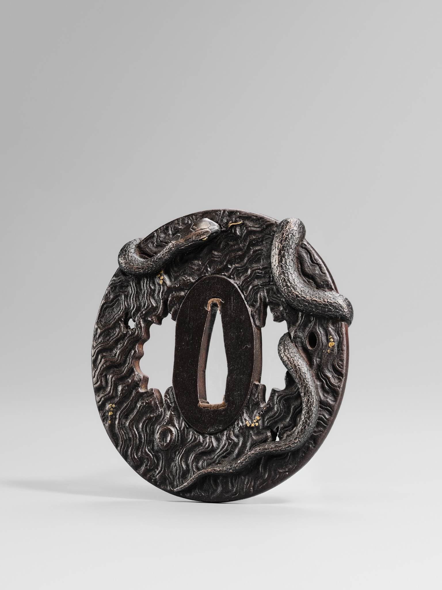 Iwamoto Ryokan | A FINE TSUBA OF A SNAKE ON A TRUNK | MutualArt