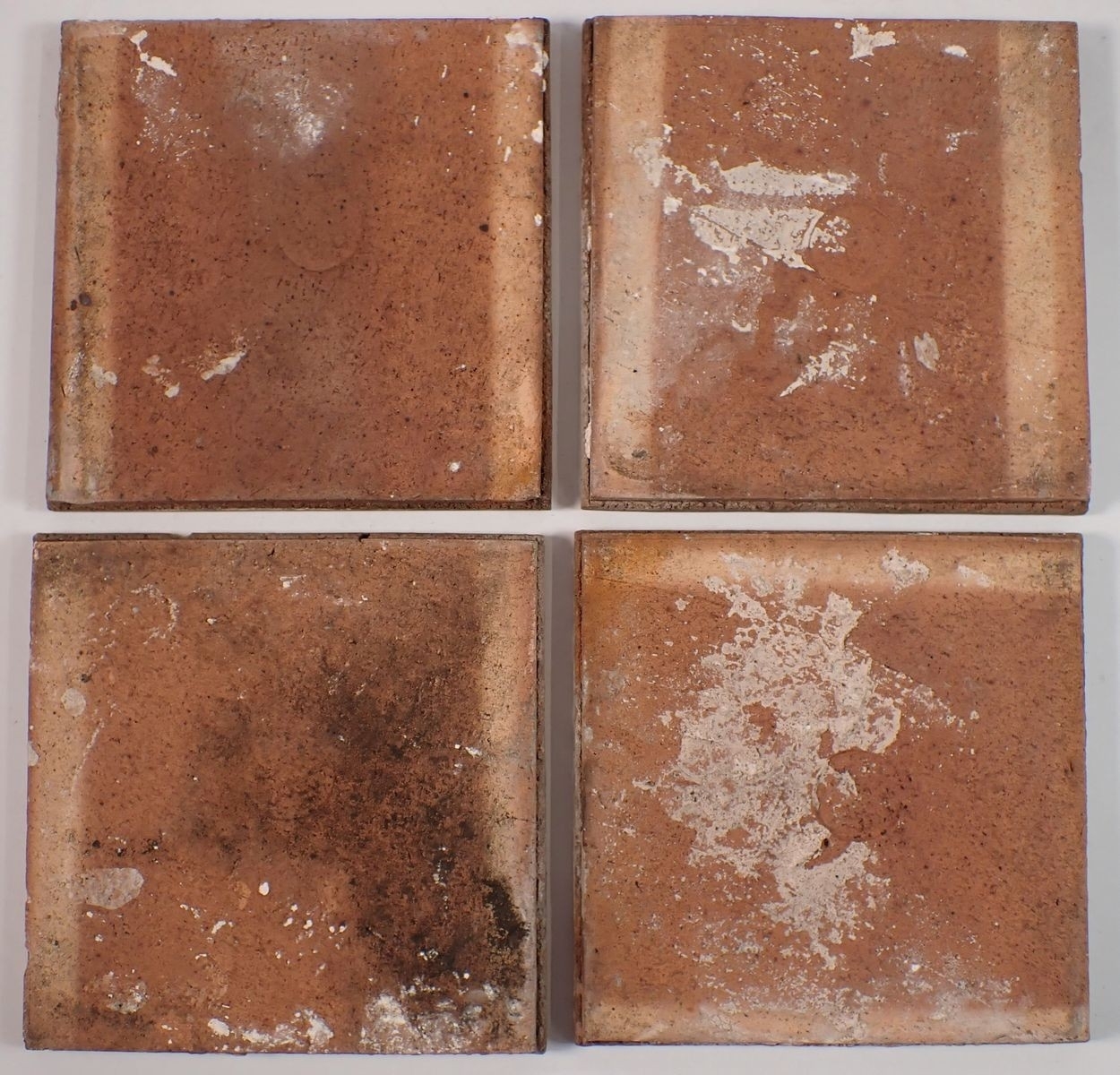William de Morgan | Set of four tiles decorated green and blue leaf and ...