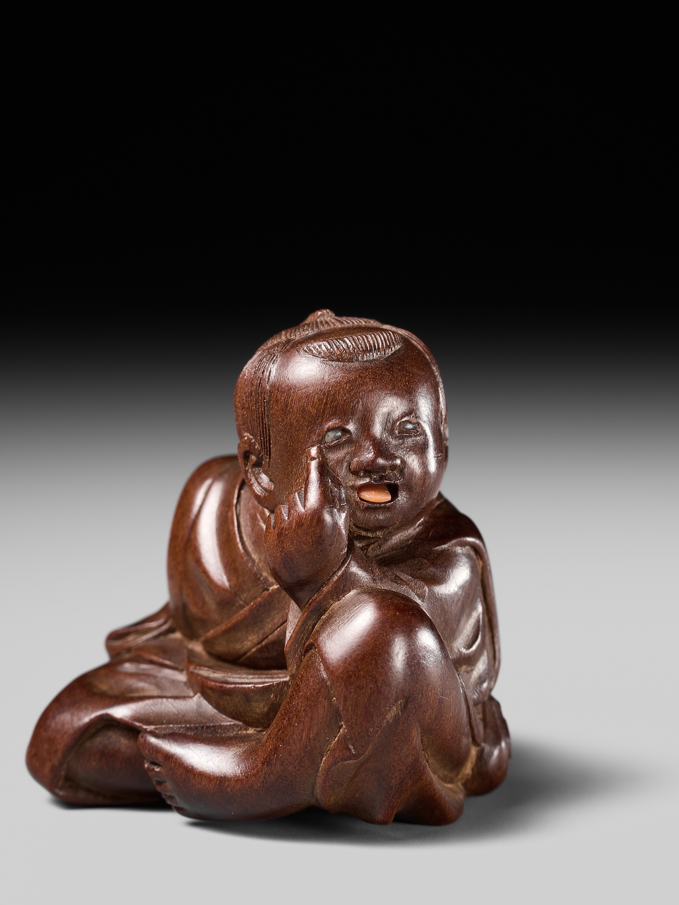 Miwa | AN INLAID WOOD NETSUKE OF A BOY WITH OKAME MASK (Early 19th ...