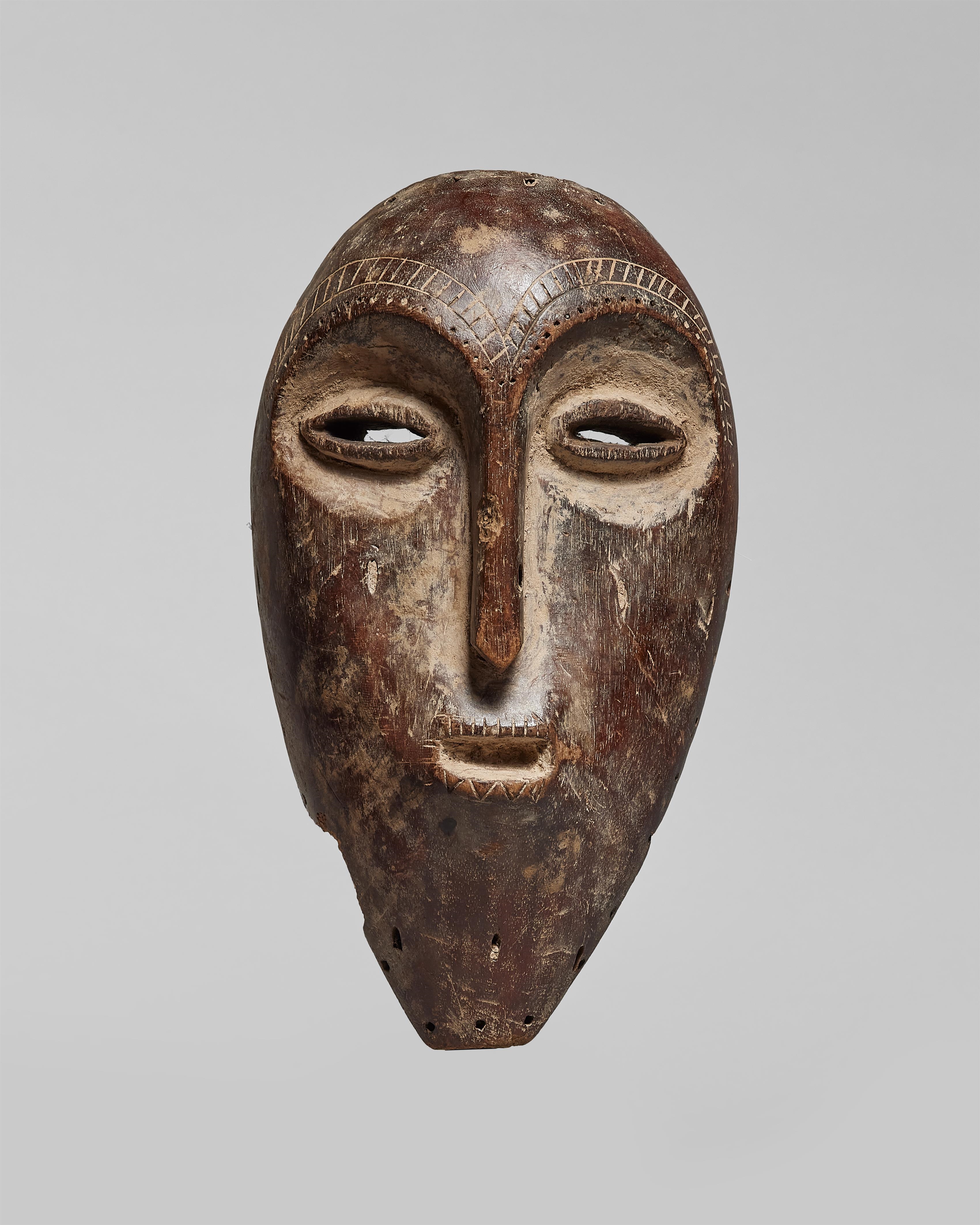 Congolese School | A Lega mask | MutualArt