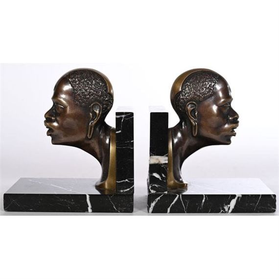 Silvain Norga | PAIR OF AFRICANIST BOOKSCREENS depicting men in profile ...