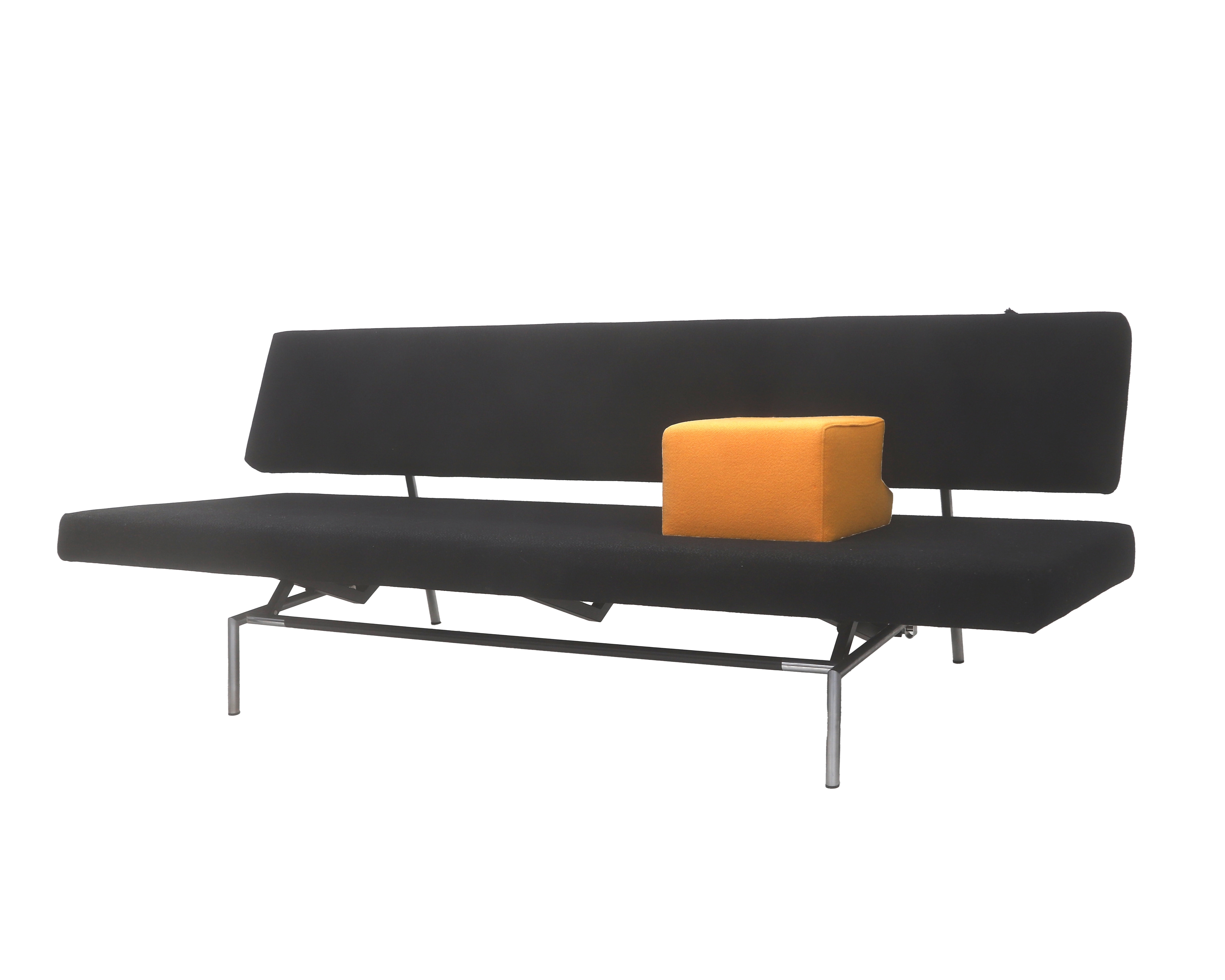 Martin Visser | A black upholstered sofa with loose yellow 'cushion ...